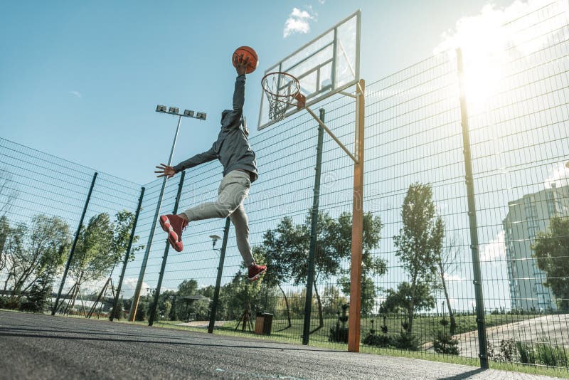 Low Angle of a Nice Young Man Throwing the Ball Stock Image - Image of ...