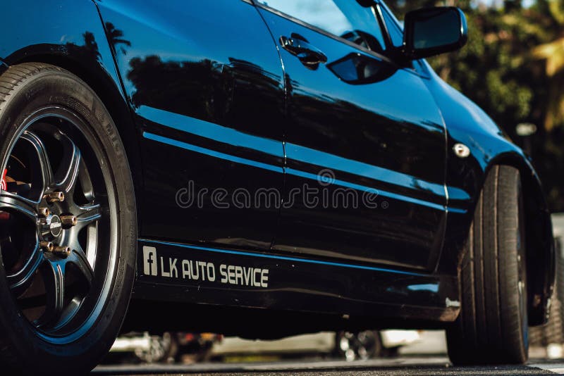 Low-angle Profile View of a Dark Blue Mitsubishi Evo 7 Car Editorial ...