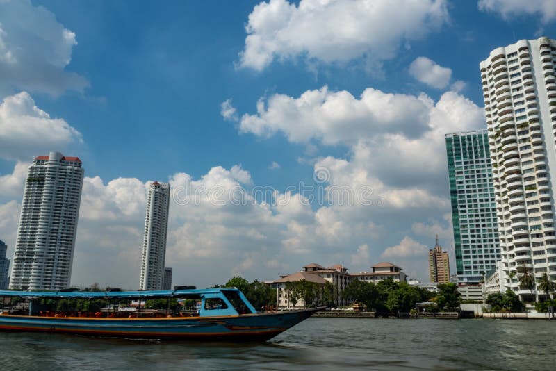Low Angle of Building with Boat Foreground and Beautiful Blue Sky ...