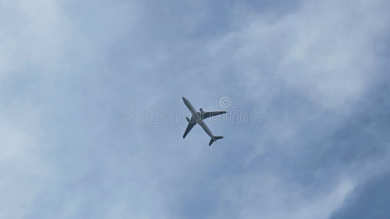 Low Angle Shot of an Airplane Flying in the Blue Sky Stock Image ...