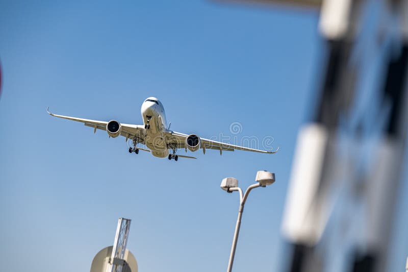 Low Angle Shot of an Airplane Flying Closer at Daytime Stock Image ...