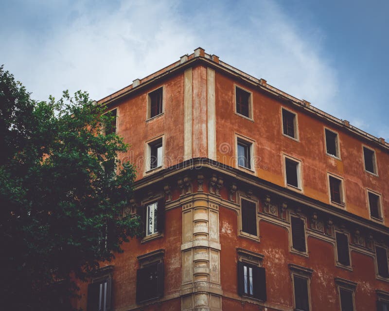 Low Angle Shot of an Ancient Brown Building with Many Windows Under the ...