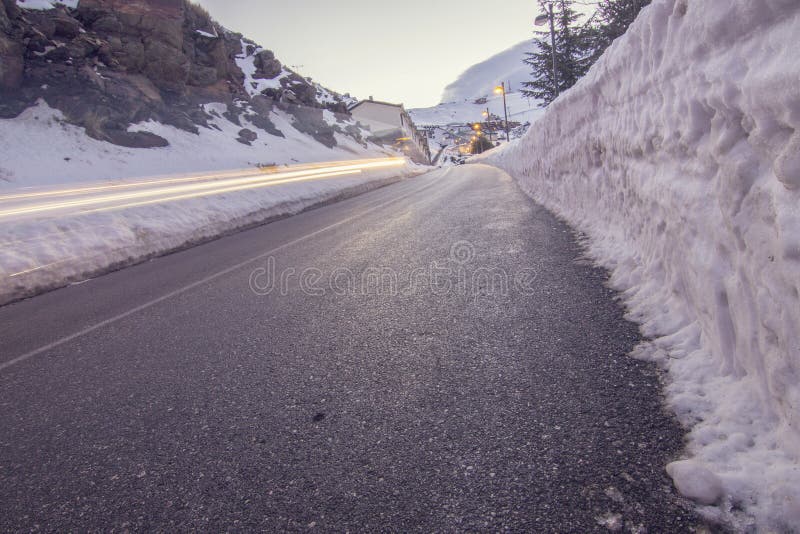 Low Angle Shot of an Asphalt Road with Sideways Full of Snow Stock ...