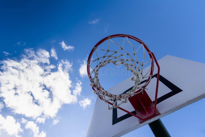 Low Angle Shot of a Basketball Hoop and the Cloudy Sky Stock Image ...