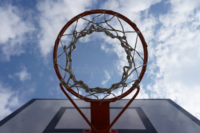 Low Angle Shot of a Basketball Ring Against a Cloudy Sky Stock Image ...