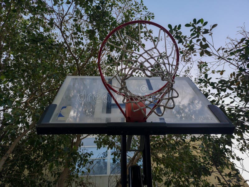Low Angle Shot of a Basketball Structure Rim in an Outdoor Backyard ...