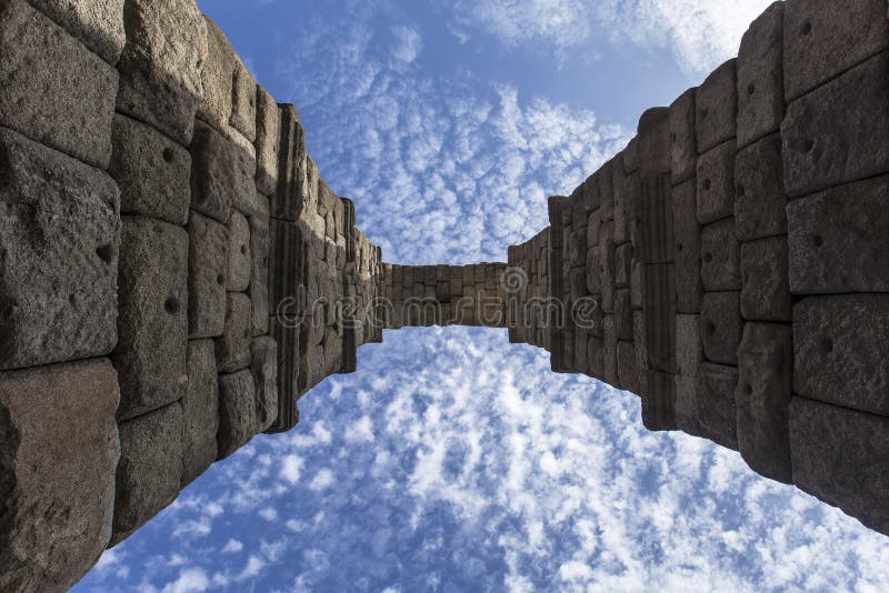 Low Angle Shot of a Beautiful High Stone Arch Under the Cloudy Sky ...