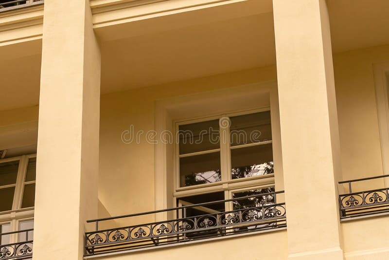 Low-angle Shot of a Beige Classic Balcony with Metallic Railings Stock ...
