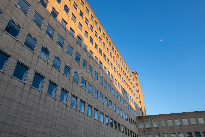 Low Angle Shot of a Big Building with Exterior Windows with Sunlight ...