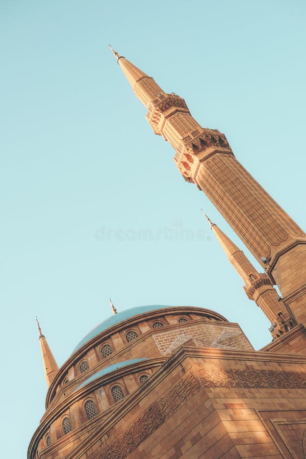 Low Angle Shot of a Brown Mosque Under the Beautiful Blue Sky Stock ...