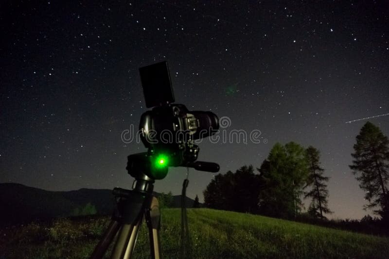 Low Angle Shot of a Camera Capturing the Beautiful View of the Starry ...