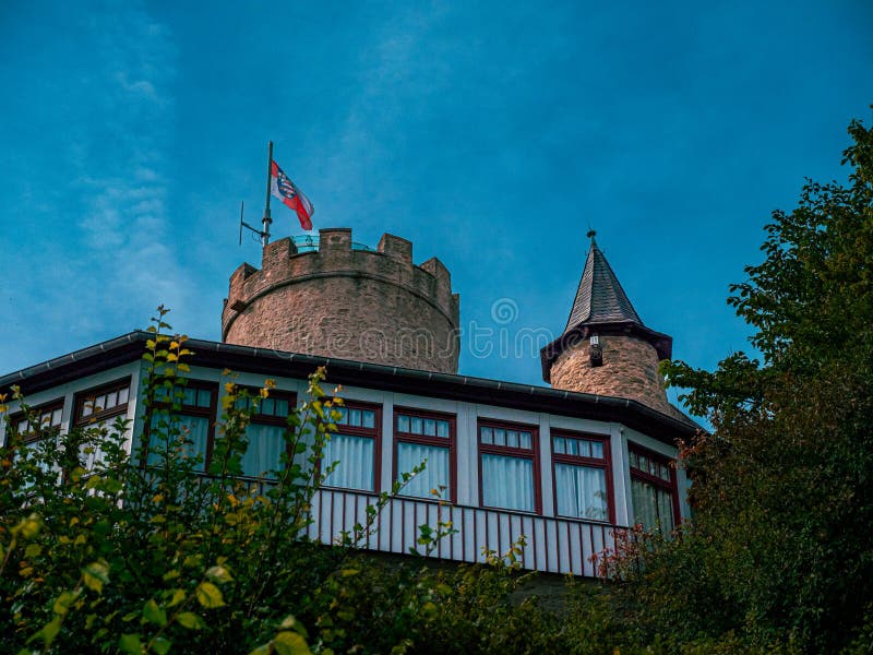 Low Angle Shot of a Castle with a Window Front and an Old Tower with a ...