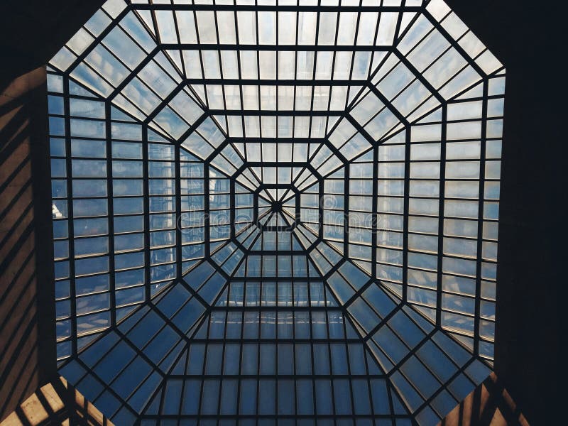 Low Angle Shot of a Ceiling with See-through Windows and Sun Rays ...