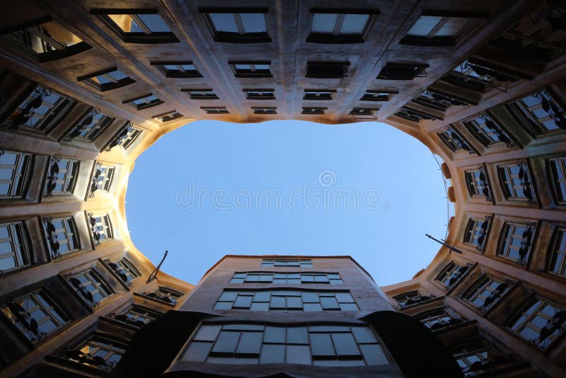 Low-angle Shot of a Circular Building with an Open Rooftop Looking at ...