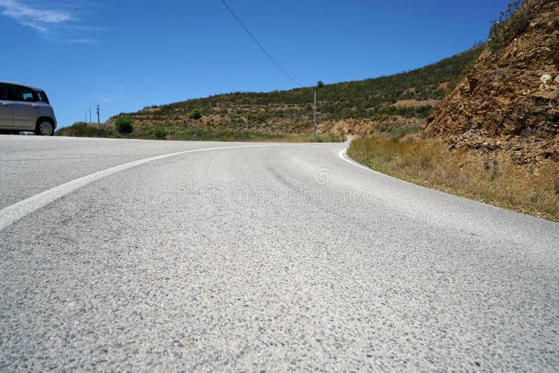 Low Angle Shot of a Concrete Road beside a Hill during a Sunny Day ...