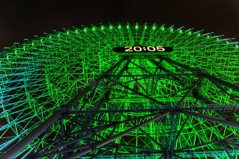 Low Angle Shot of the Cosmo Clock 21 Ferris Wheel at Night and ...