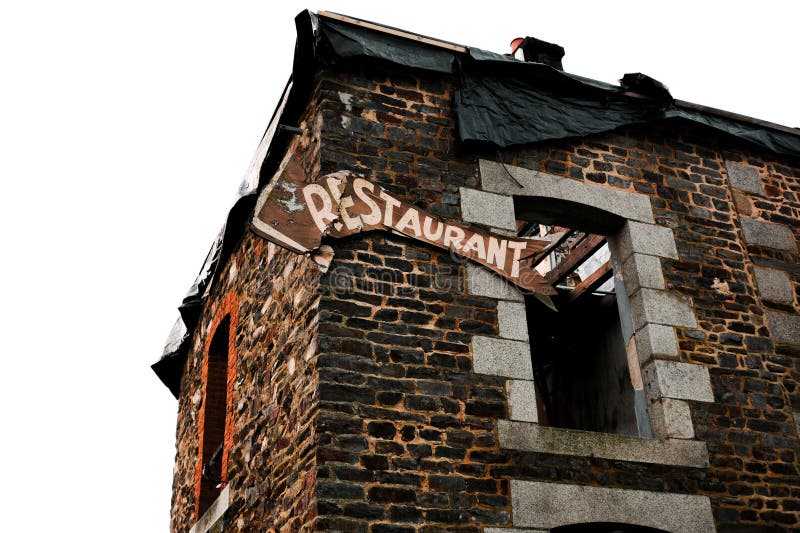 Low Angle Shot of Dilapidated Brick Building with a Broken Restaurant ...