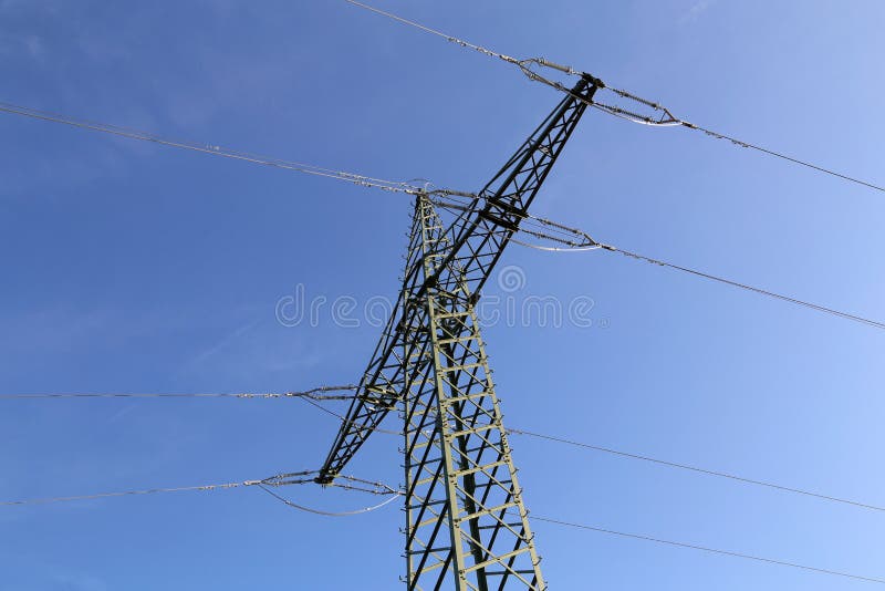 Low Angle Shot of an Electric Pole with Transmission Lines Under Blue ...