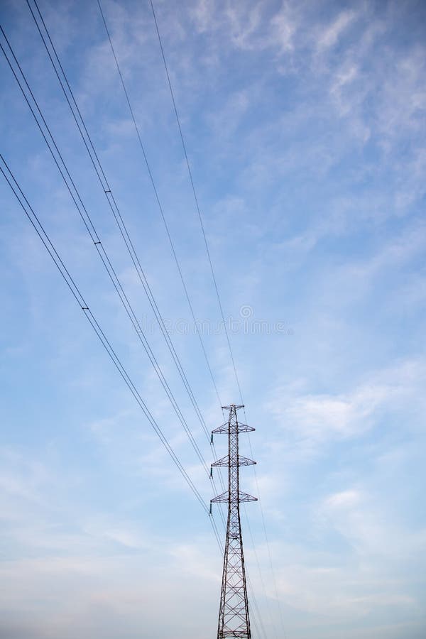 Low Angle Shot of an Electric Post and Wire with a Cloudy Blue Sky ...