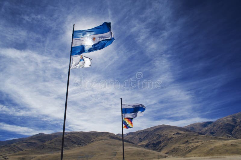 Low Angle Shot of the Flag of Argentina with Small Native Peoples Flags ...