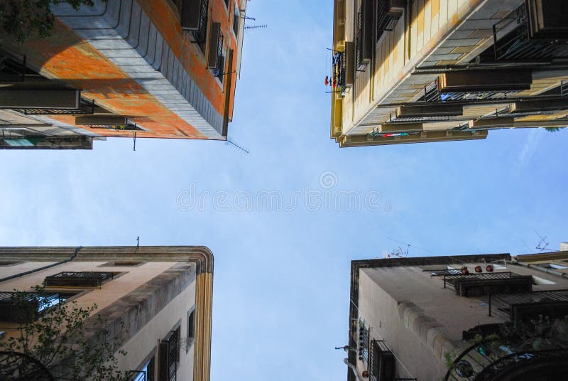 Low-angle Shot of Four Residential Buildings on the Blue Sky Background ...