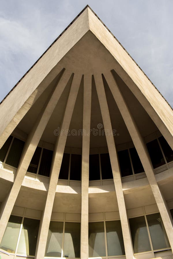 Low Angle Shot of the Front of an Architectural Building with a Pointed ...