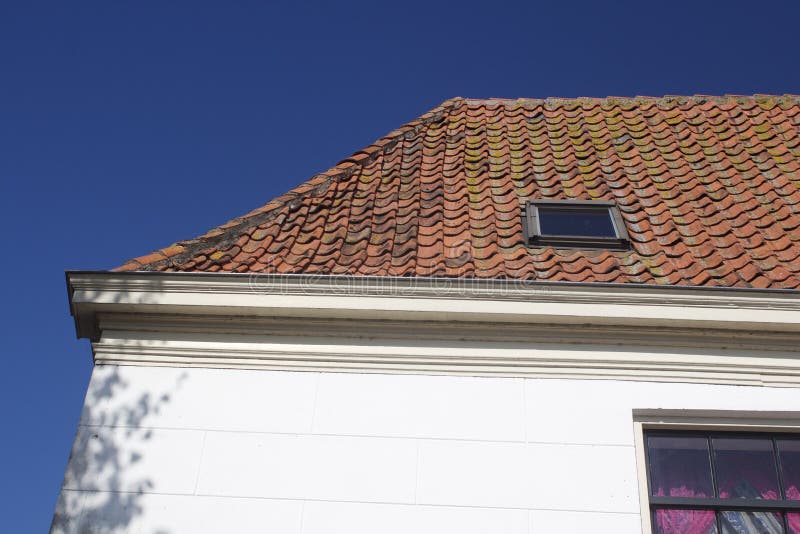 Low Angle Shot of a Gable House Under a Blue Sky in Holland Stock Photo ...
