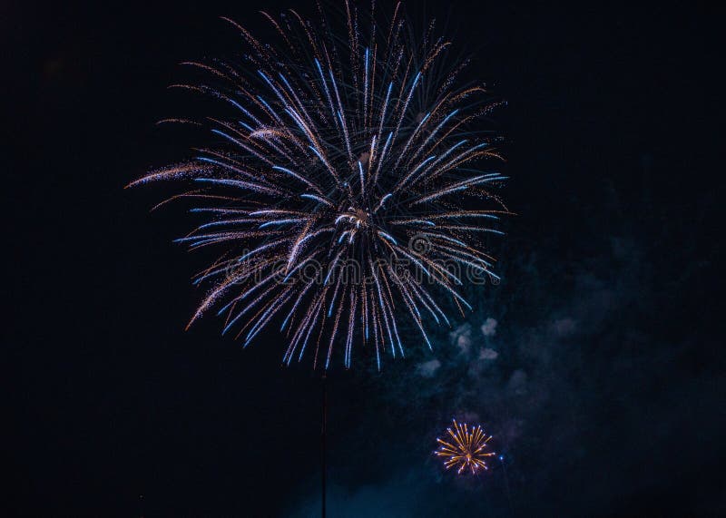 Low Angle Shot of Glowing Fireworks Popping in the Night Sky Stock ...