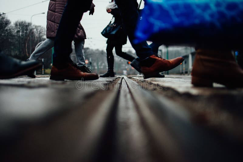 Low Angle Shot of a Group of People Walking on the Street Stock Image ...