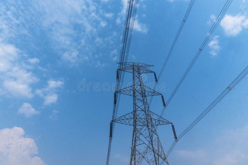 Low-angle Shot of a High Pipeline Pylon Electrical Network on a Blue ...