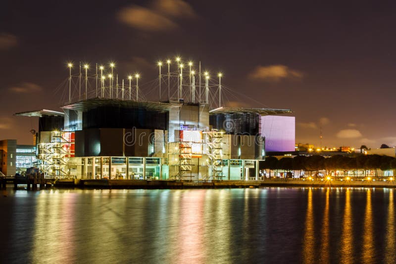 Low Angle Shot of an Industrial Building at Night with the Reflection ...