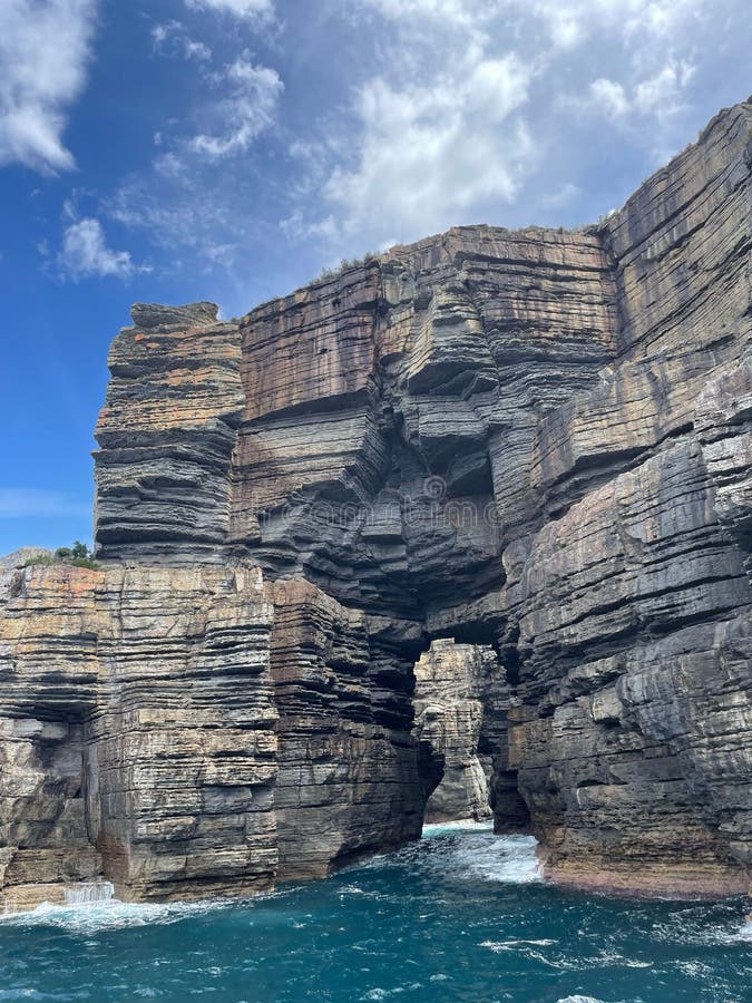 Low Angle Shot of a Large Cave in the Ocean Stock Photo - Image of view ...
