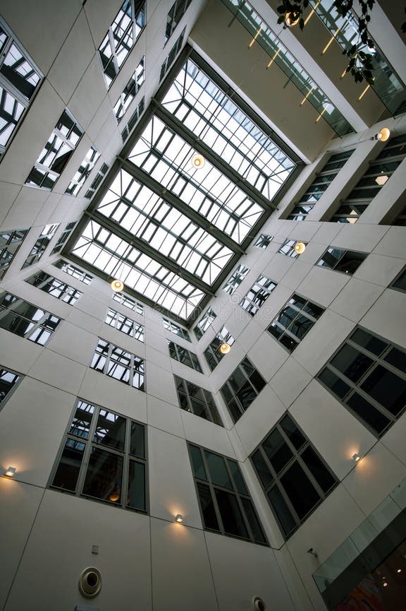 Low Angle Shot of a Large Modern Building Interior with a Glass Ceiling ...