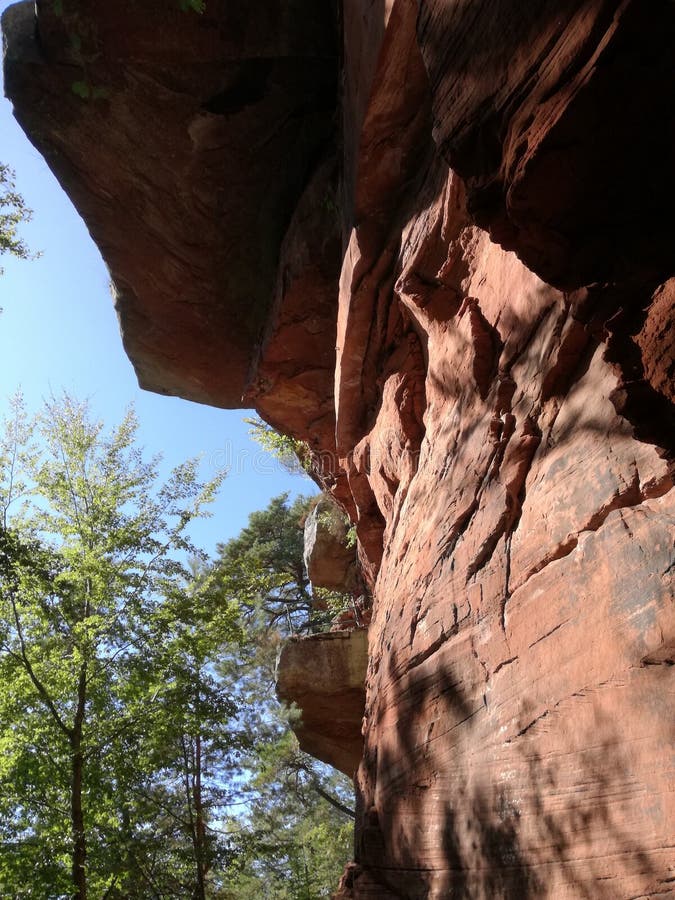 Low Angle Shot of a Large Red Rock Cliff Stock Image - Image of large ...