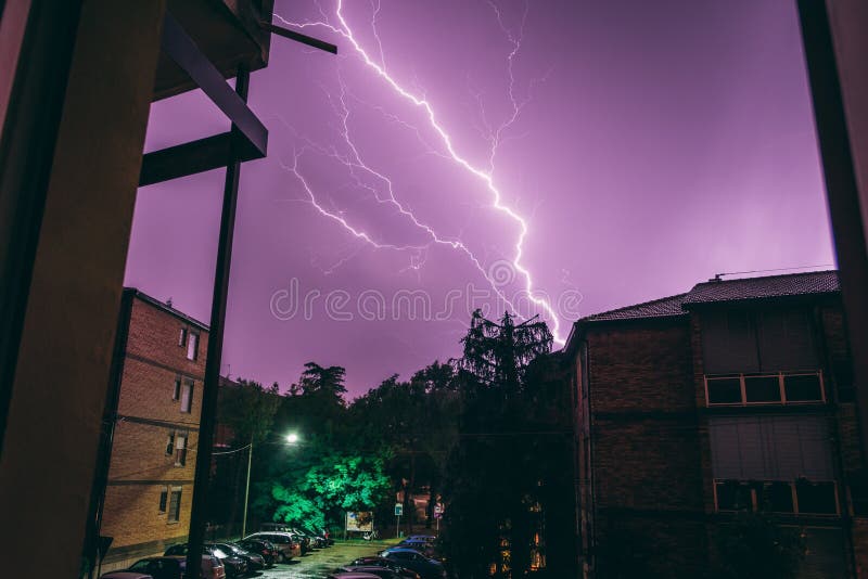 Low Angle Shot of a Lightning Strike in a Beautiful Purple Sky Stock ...