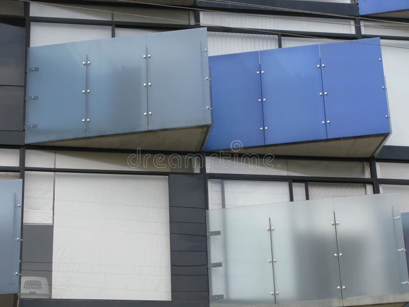 Low Angle Shot of a Modern Building Facade with Colorful Glasses Stock ...