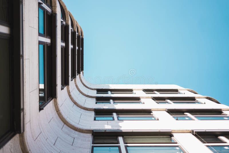 Low Angle Shot of a Modern Building with Large Glass Windows Stock ...