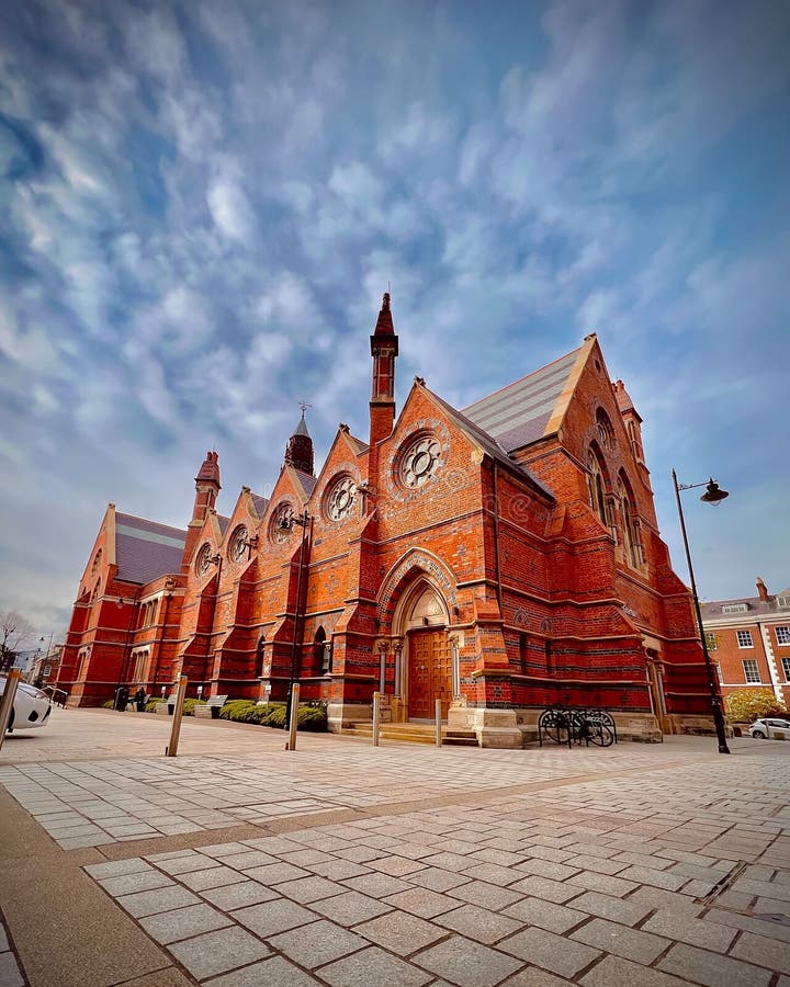 Low-angle Shot of a Modern Cathedral Made of Red Stone Under the Cloudy ...