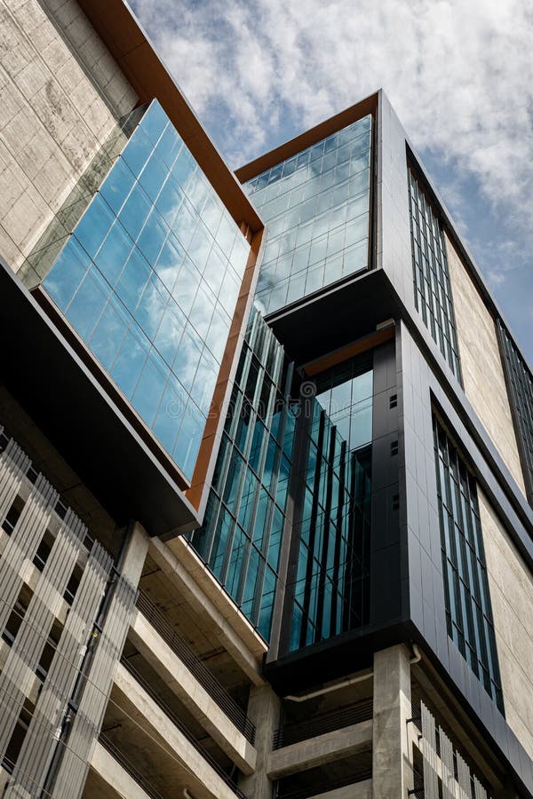 Low-angle Shot of a Modern High Rise Building with Large Glass Windows ...