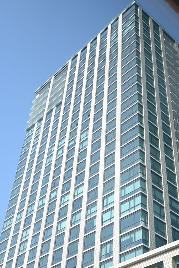Low Angle Shot of a Modern Skyscraper with Glass Windows, Seen from a ...