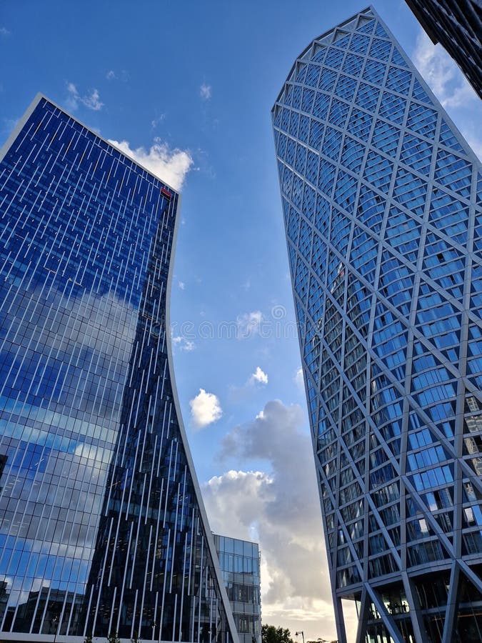 Low Angle Shot of Modern Tall Buildings Udner a Light Blue Sky ...