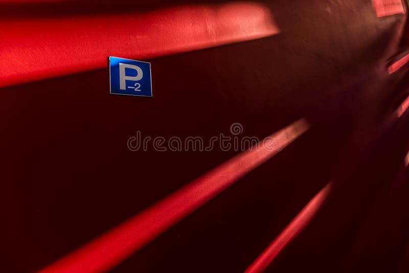 Low Angle Shot of a Parking Level Sign on a Red Wall Stock Image ...