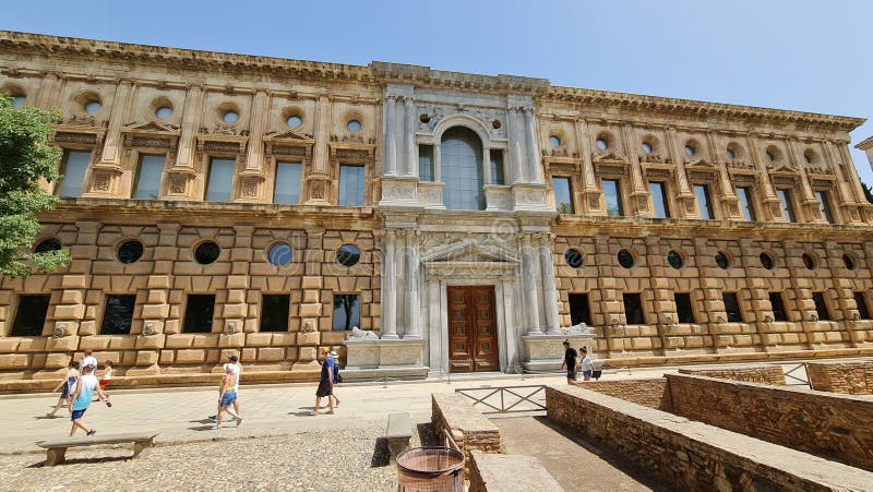 Low Angle Shot of People Walking Against the Alhambra Castle in Granada ...