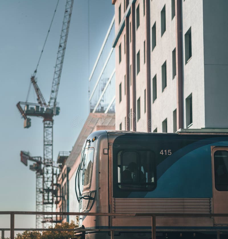 Low Angle Shot of a Public Transport and a Process of Construction on ...