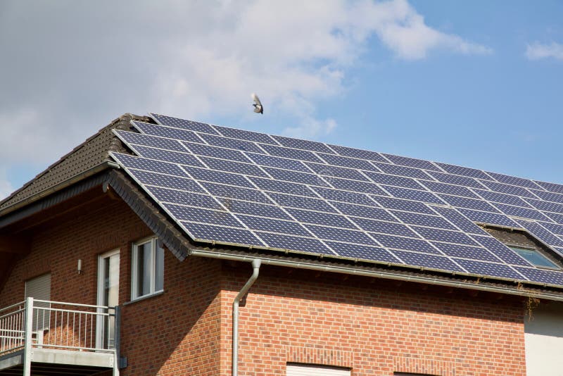 Low Angle Shot of PV Solar Panels on the Roof of a Building Stock Photo ...