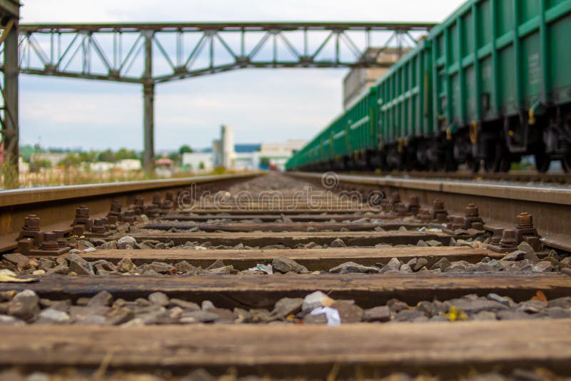 Low Angle Shot of a Railroad and a Green Train Stock Photo - Image of ...