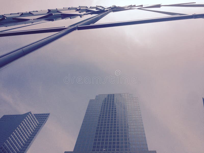 Low Angle Shot of the Reflection of a Skyscraper in the Mirror Walls of ...