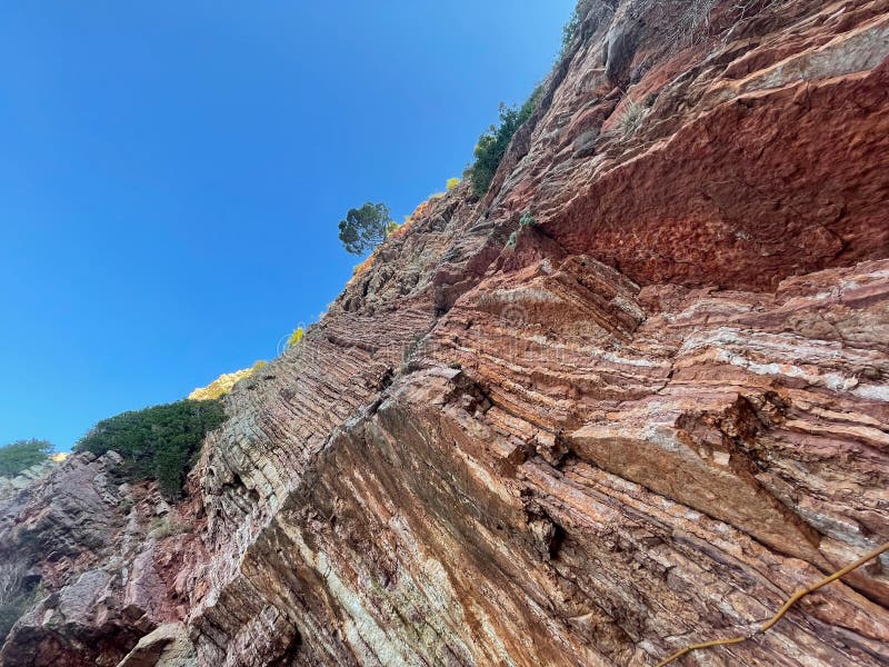 Low Angle Shot of a Rocky Cliff Stock Photo - Image of clouds, nature ...