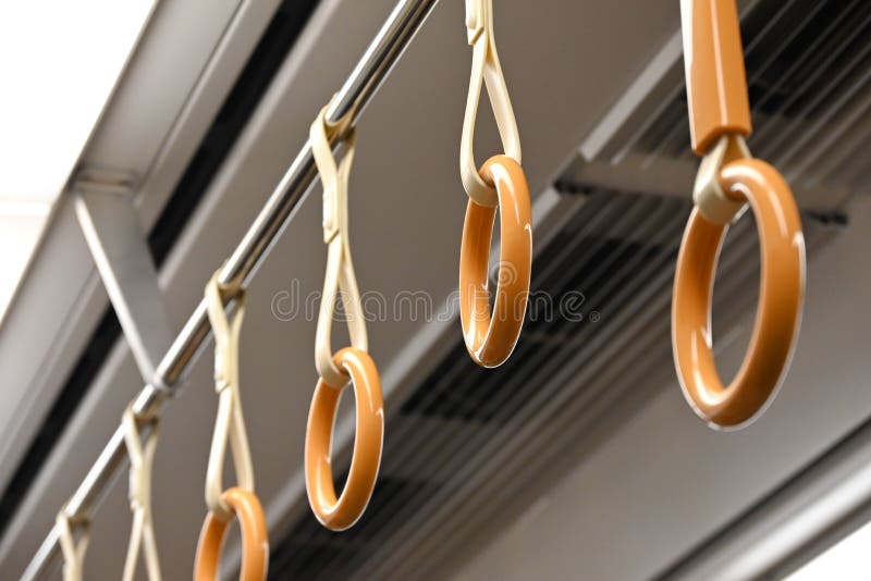 Low Angle Shot of Round Handles Hanging on a Train Stock Image - Image ...