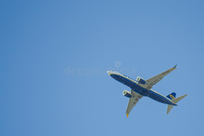 Low Angle Shot of the Ryanair Plane Flying in the Blue Sky with Copy ...
